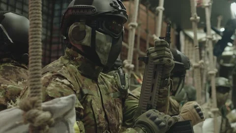 Group of Seated Soldiers Loading weapons... | Stock Video | Pond5