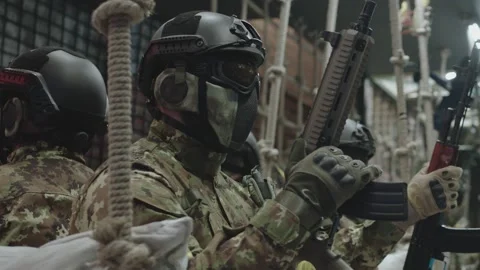 Group of Seated Soldiers Loading weapons... | Stock Video | Pond5