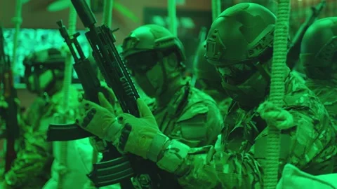 Group of Seated Soldiers Loading weapons... | Stock Video | Pond5