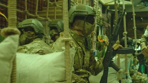 Group of Seated Soldiers Loading weapons... | Stock Video | Pond5