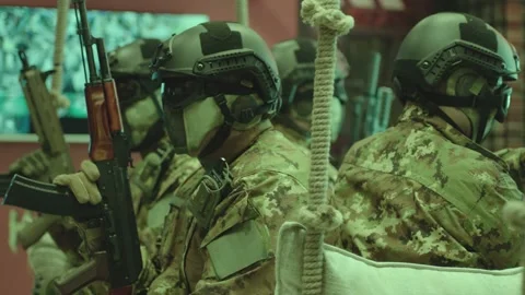 Group of Seated Soldiers Loading weapons... | Stock Video | Pond5