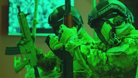 Group of Seated Soldiers Loading weapons... | Stock Video | Pond5