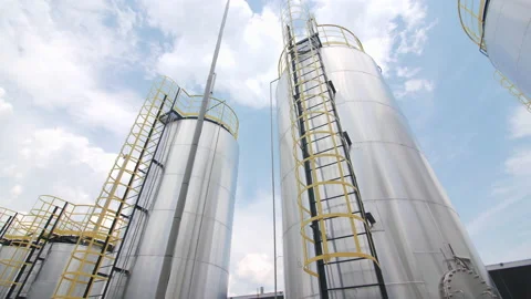 Group of tanks with service ladders at c... | Stock Video | Pond5