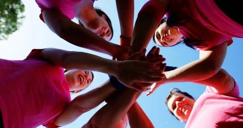 Group of women forming hand stack during... | Stock Video | Pond5