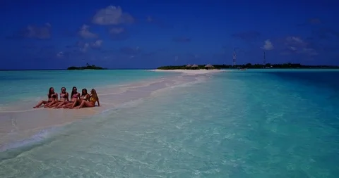 Group of young girls in bikini sunbath o... | Stock Video | Pond5