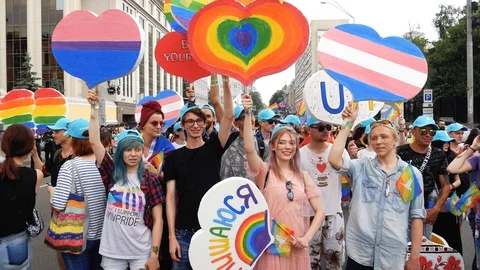 Group of young happy people holding LGBT... | Stock Video | Pond5