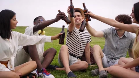 Group of young people having fun sitting... | Stock Video | Pond5