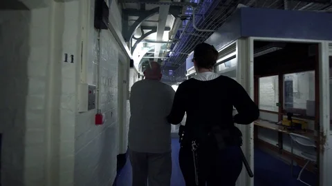 Guard Escorts Prisoner With Handcuffs, 4... | Stock Video | Pond5