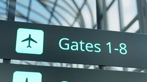 Guide sign showing way to different gate... | Stock Video | Pond5