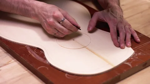 Guitar maker shapes the sound hole roset... | Stock Video | Pond5