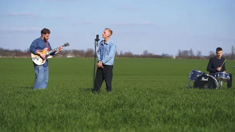 Guitarist, drummer and singer make perfo... | Stock Video | Pond5