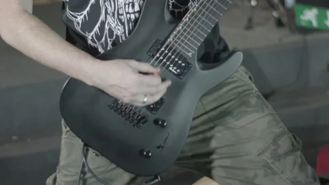 Guitarist playing on a black seven strin... | Stock Video | Pond5