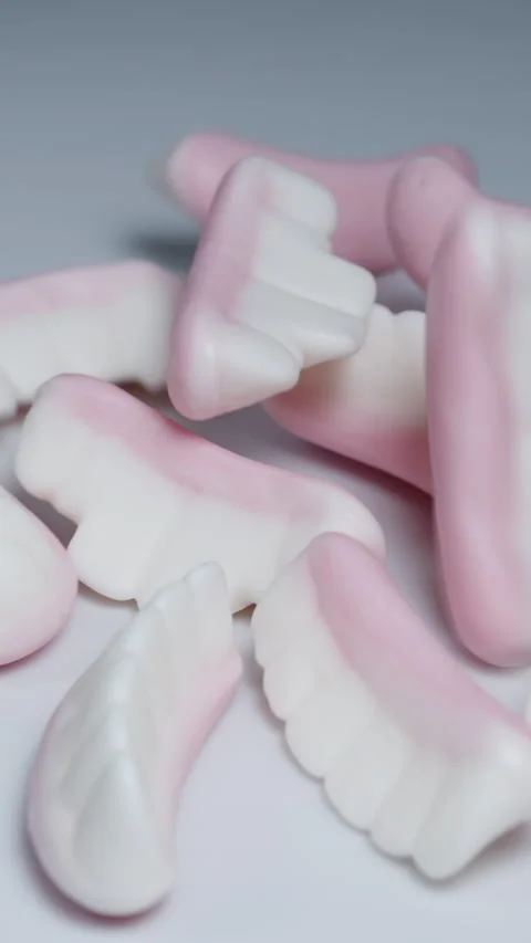 Gummy candies in the shape of jaws with ... | Stock Video | Pond5