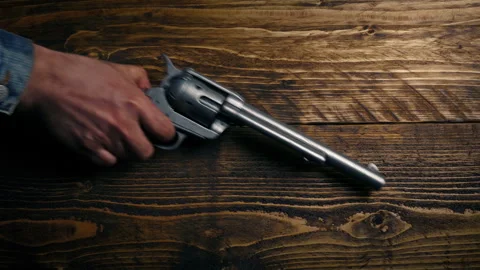 Gun Taken Off Table - Hand And Gloved Ha... | Stock Video | Pond5