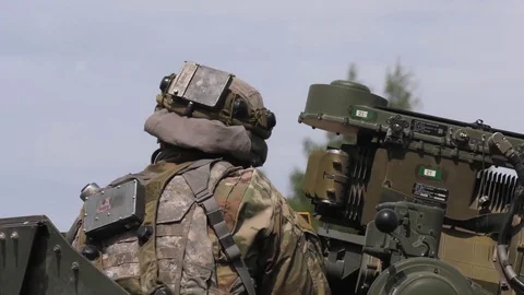 Gunner firing machine gun from armoured ... | Stock Video | Pond5