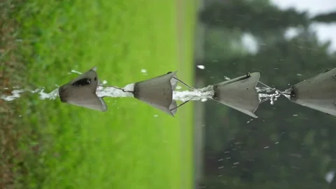 Gutter drip chain on rainy day. Vertical... | Stock Video | Pond5