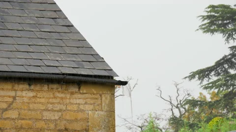 Gutter of old stone house leaking in the... | Stock Video | Pond5