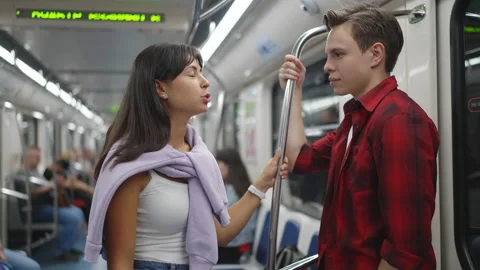 A guy and a woman go to the subway, stan... | Stock Video | Pond5