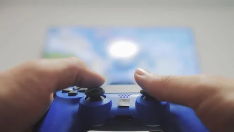 The guy boy is playing on controller joy... | Stock Video | Pond5