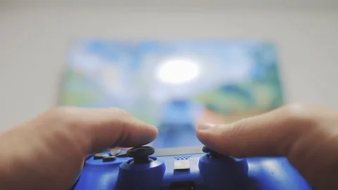 The guy boy is playing on controller joy... | Stock Video | Pond5