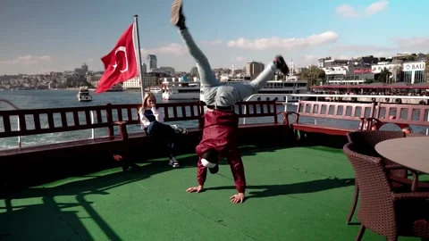 Guy breakdancing on the deck of a ship i... | Stock Video | Pond5