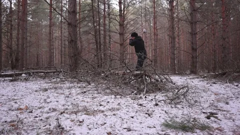 A guy chopping a log with an axe in the ... | Stock Video | Pond5