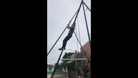 The guy climbs on a horizontal bar in Du... | Stock Video | Pond5