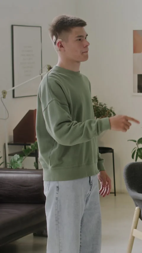 Guy with Cochlear Implant Signing Hello,... | Stock Video | Pond5