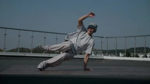 The guy coolly dances breakdance on the ... | Stock Video | Pond5