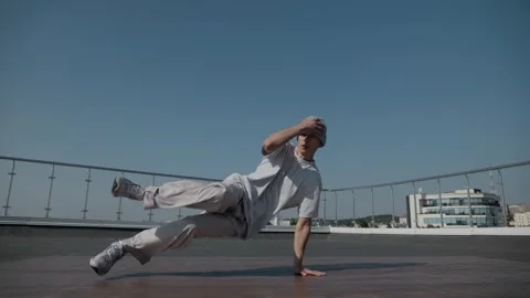 The guy coolly dances breakdance on the ... | Stock Video | Pond5