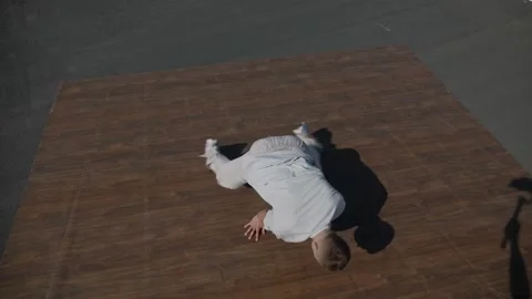 The guy coolly dances breakdance on the ... | Stock Video | Pond5