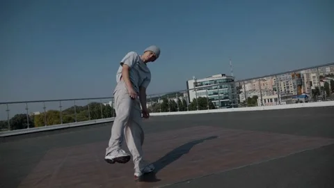 The guy coolly dances breakdance on the ... | Stock Video | Pond5