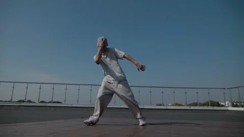 The guy coolly dances breakdance on the ... | Stock Video | Pond5