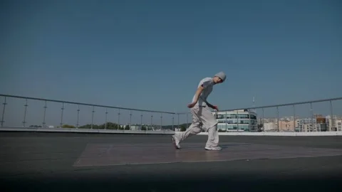 The guy coolly dances breakdance on the ... | Stock Video | Pond5