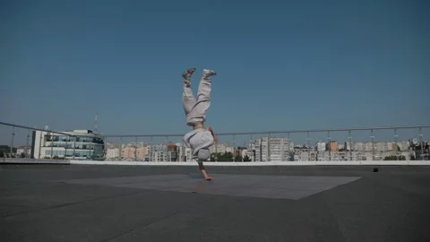 The guy coolly dances breakdance on the ... | Stock Video | Pond5
