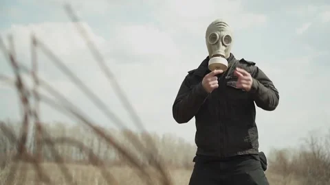 The guy in the gas mask on the backgroun... | Stock Video | Pond5