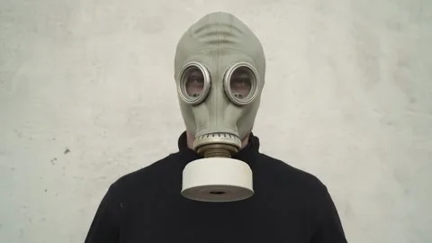 The guy in the gas mask. on a white back... | Stock Video | Pond5