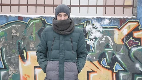 Guy getting snowball on head during play... | Stock Video | Pond5