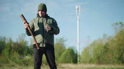 The guy is juggling a big wooden basebal... | Stock Video | Pond5