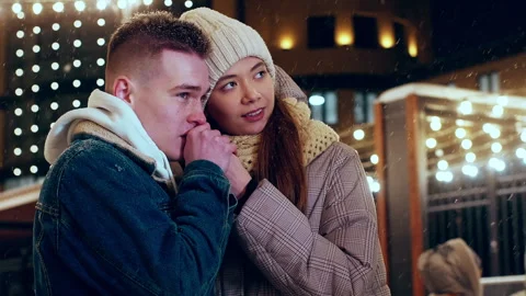 Guy kiss girl hand standing on street wi... | Stock Video | Pond5