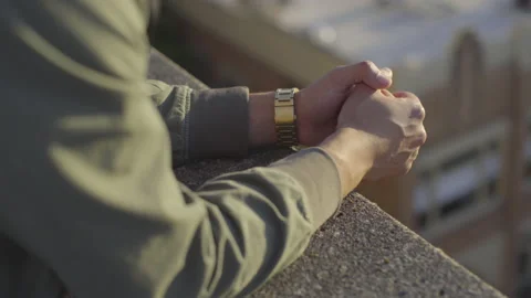 Guy Leaning on the Edge of Building Roof... | Stock Video | Pond5