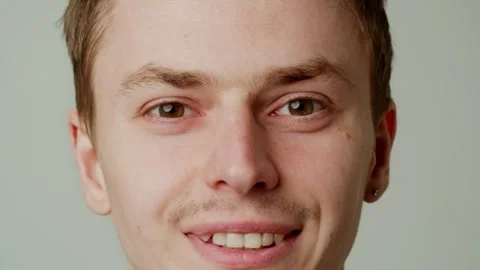 A guy model with beautiful smile is posi... | Stock Video | Pond5