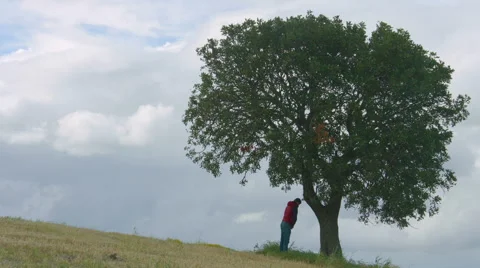 Guy peeing in park, young man urinating ... | Stock Video | Pond5