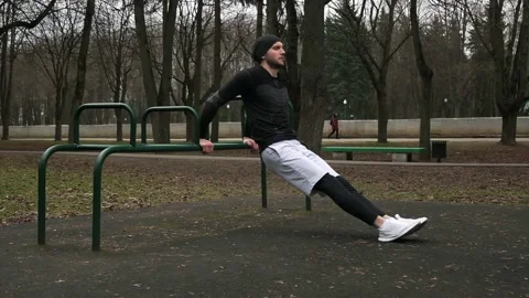 the guy performs the exercise reverse pu... | Stock Video | Pond5