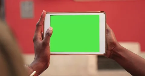 Guy showing tablet green screen outdoors... | Stock Video | Pond5