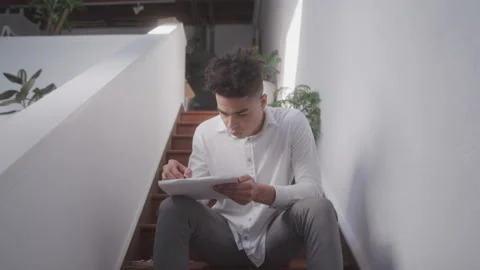 Guy Sits On Steps Drawing | Stock Video | Pond5