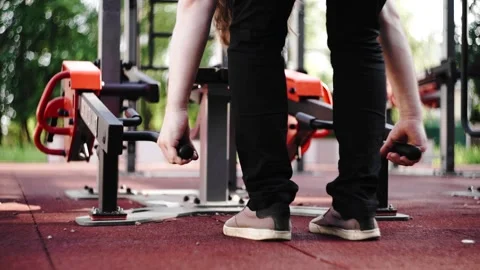 A guy with two hands lifts weight on a s... | Stock Video | Pond5