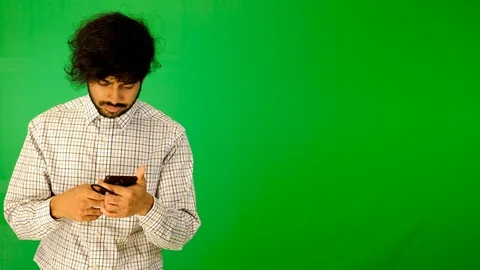 guy using mobile / tablet with green scr... | Stock Video | Pond5