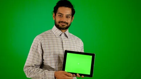 guy using mobile / tablet with green scr... | Stock Video | Pond5