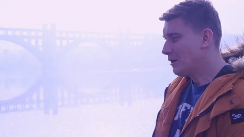 The guy in the yellow jacket, tells a jo... | Stock Video | Pond5